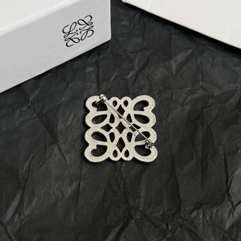 Indistinguishable Loewe Brooches
