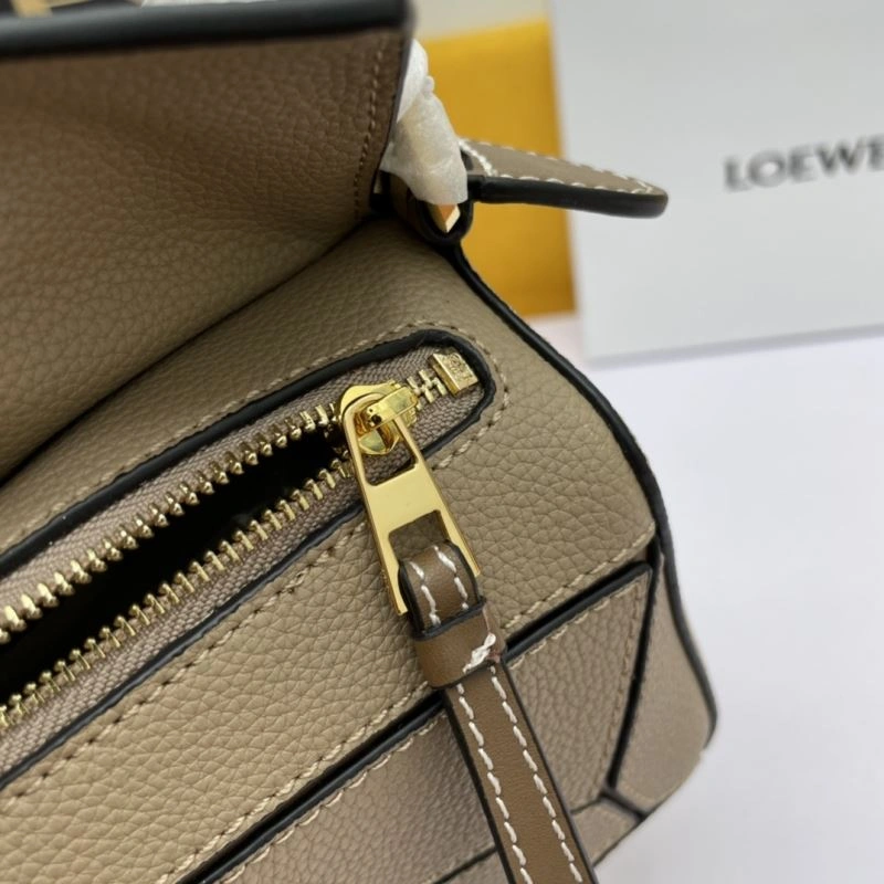 Indistinguishable Loewe Puzzle Bags
