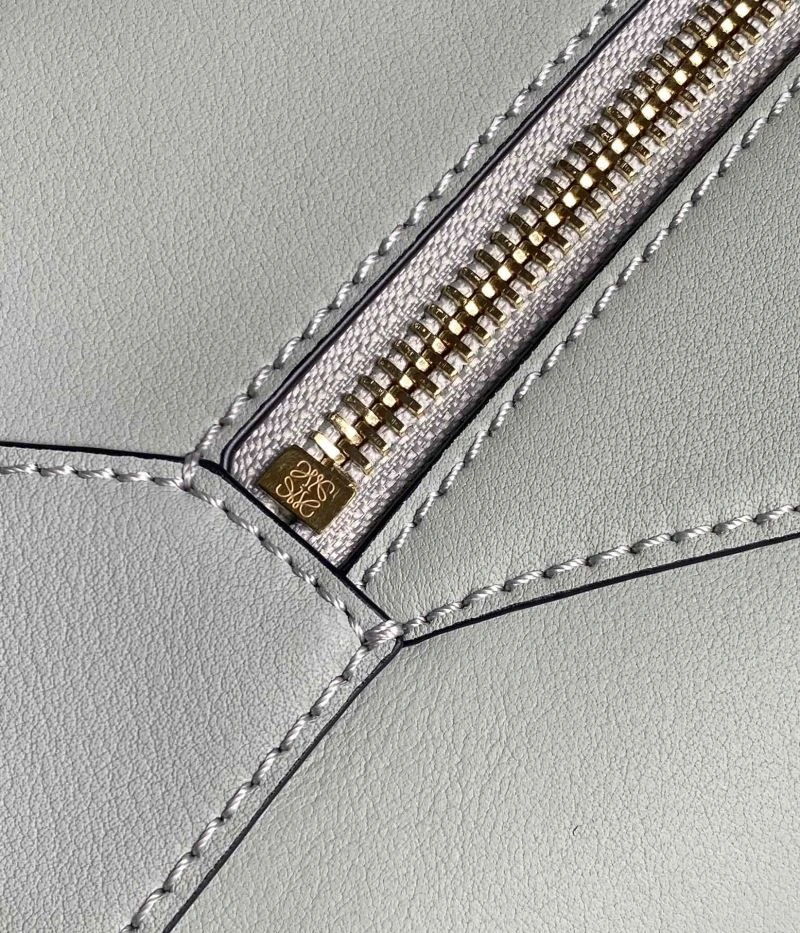 Indistinguishable Loewe Puzzle Bags