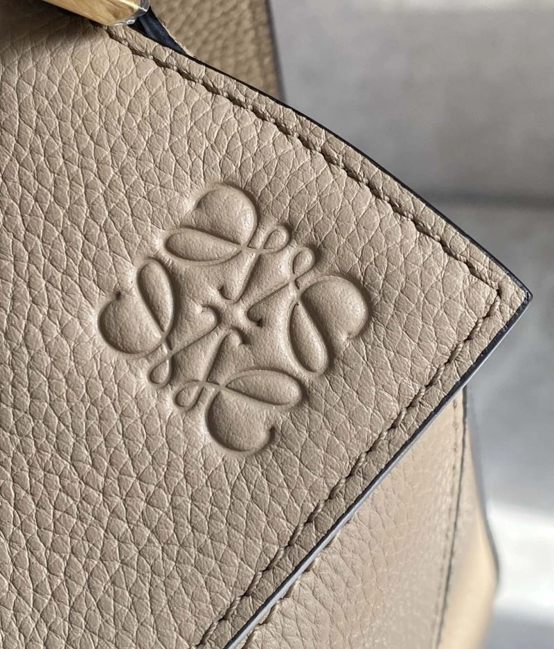Indistinguishable Loewe Puzzle Bags