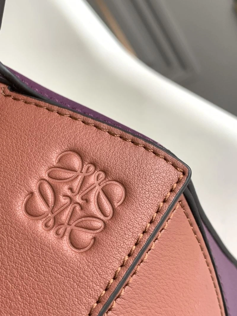 Indistinguishable Loewe Puzzle Bags