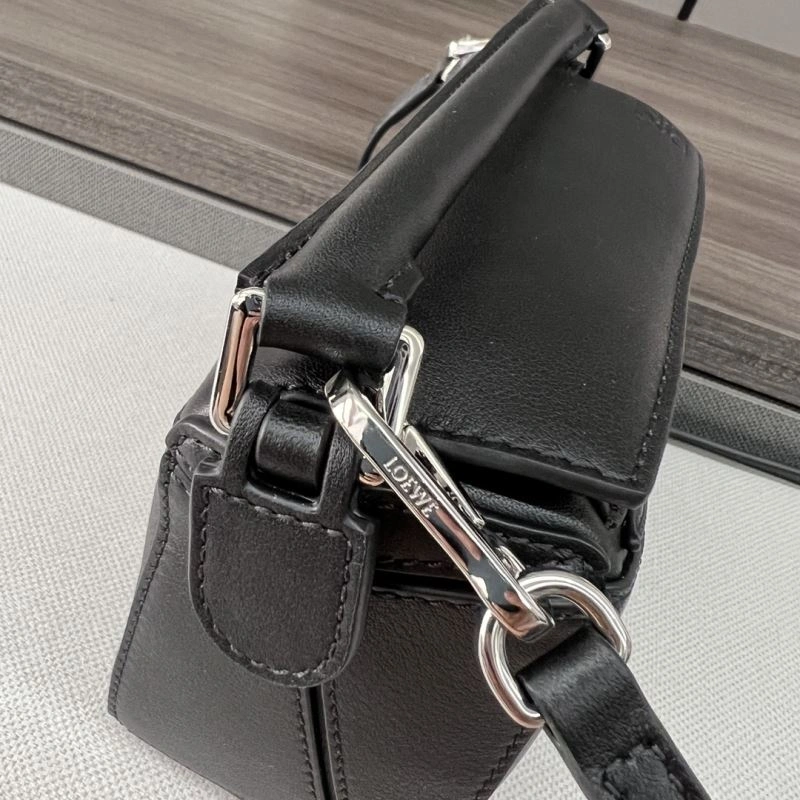 Indistinguishable Loewe Puzzle Bags
