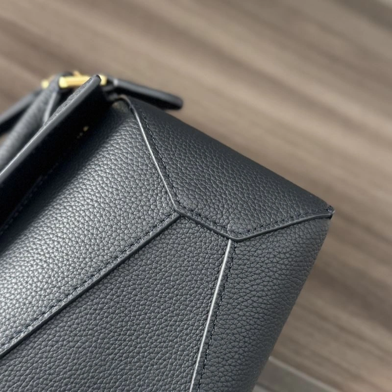 Indistinguishable Loewe Puzzle Bags