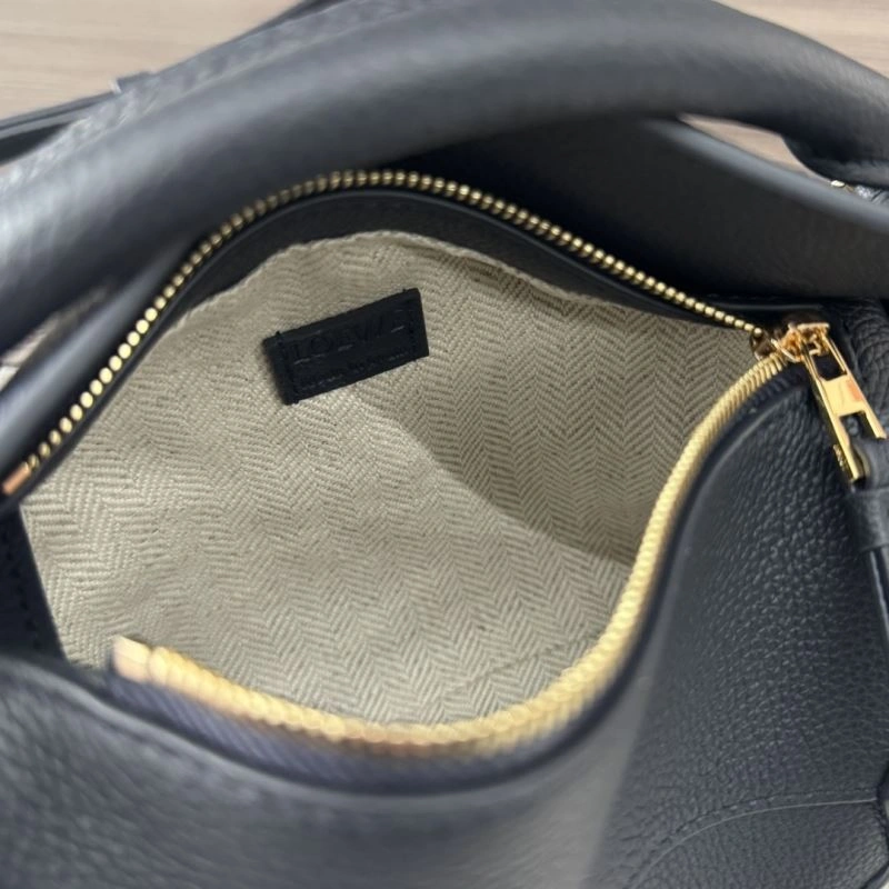 Indistinguishable Loewe Puzzle Bags