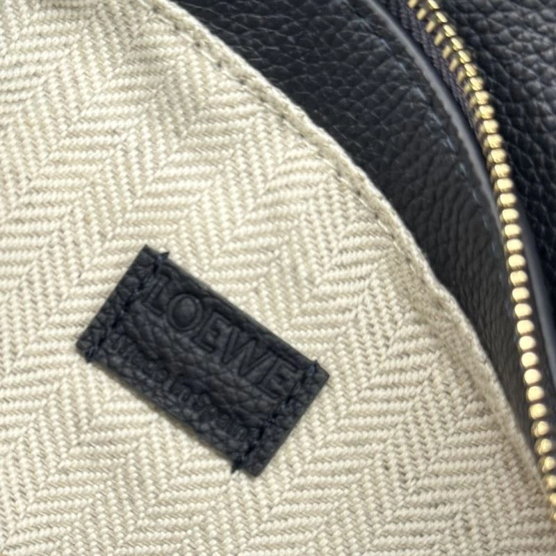 Indistinguishable Loewe Puzzle Bags