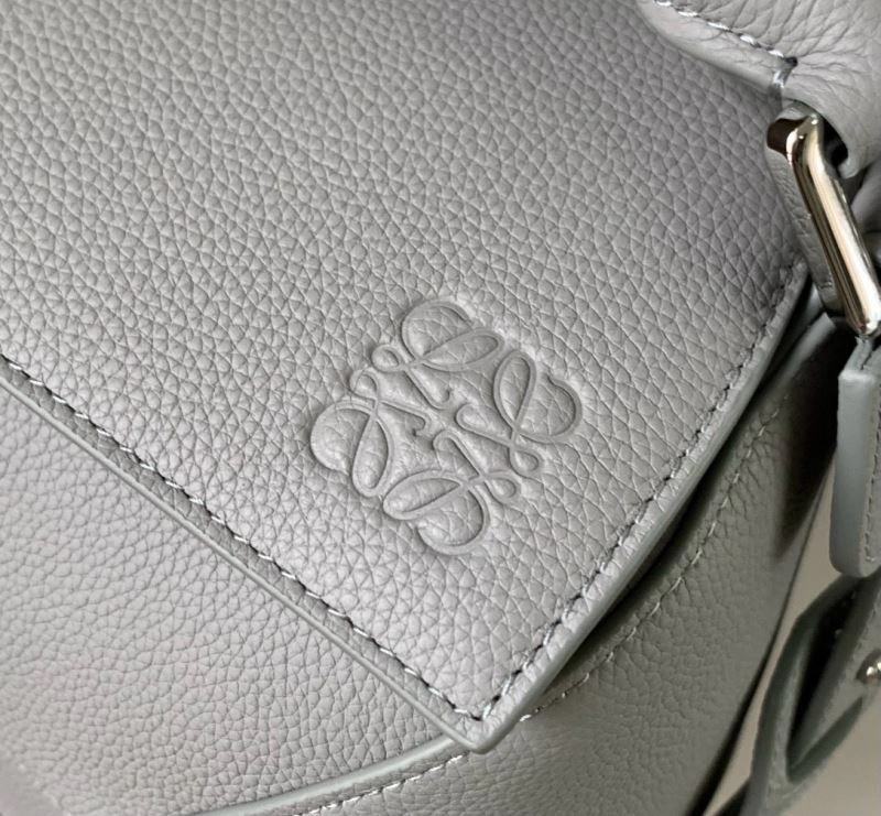 Indistinguishable Loewe Puzzle Bags