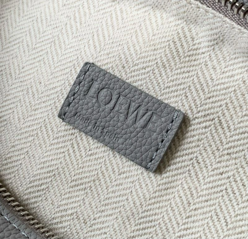 Indistinguishable Loewe Puzzle Bags