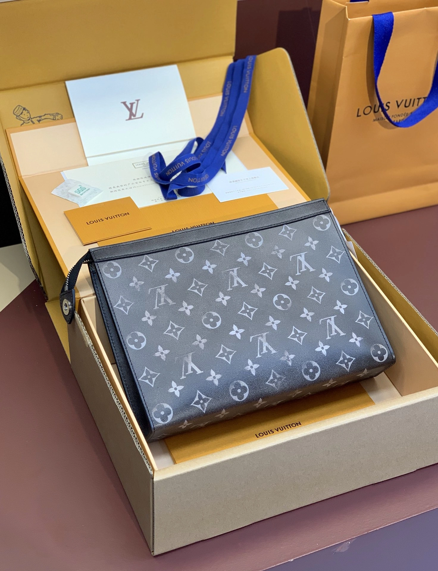 Brand-authenticated Louis Vuitton Clutch Bags