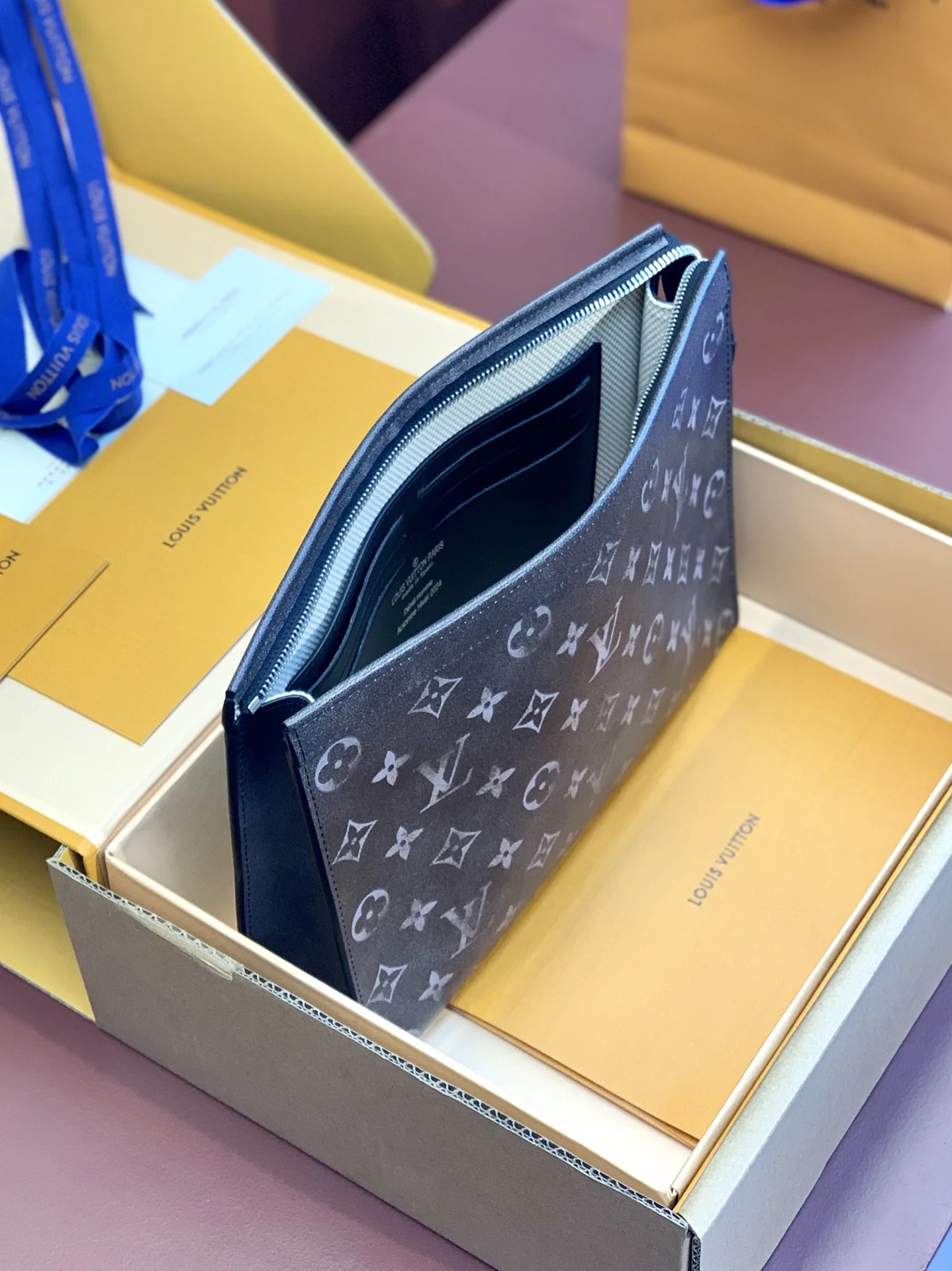 Brand-authenticated Louis Vuitton Clutch Bags