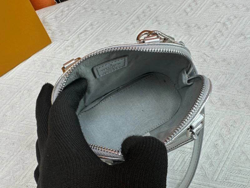 Brand-authenticated Louis Vuitton Top Handle Bags