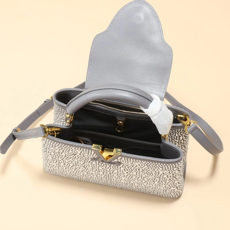 Brand-authenticated Louis Vuitton Top Handle Bags