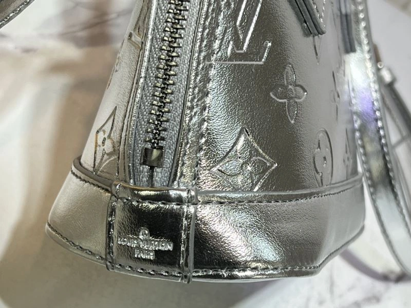 Brand-authenticated Louis Vuitton Top Handle Bags