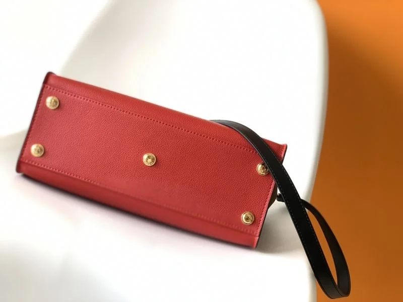 Brand-authenticated Louis Vuitton Top Handle Bags