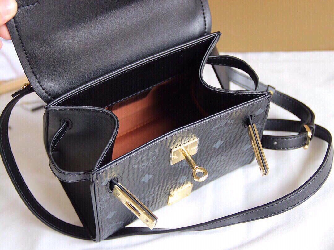 Indistinguishable MCM Top Handle Bags