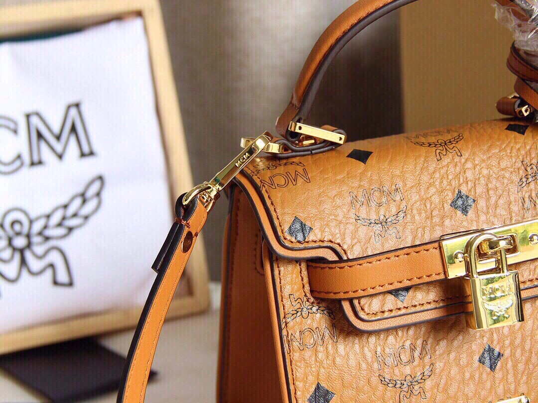 Indistinguishable MCM Top Handle Bags