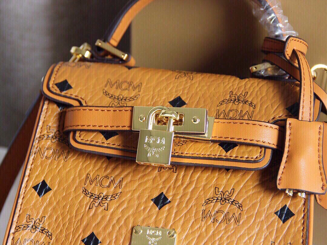 Indistinguishable MCM Top Handle Bags