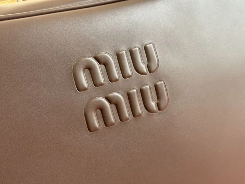Indistinguishable Miu Miu Briefcases