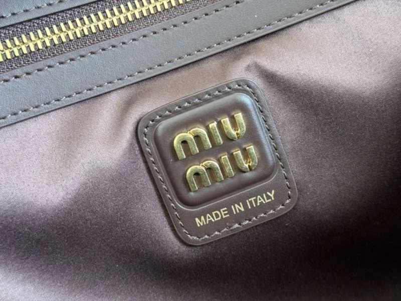 Indistinguishable Miu Miu Briefcases
