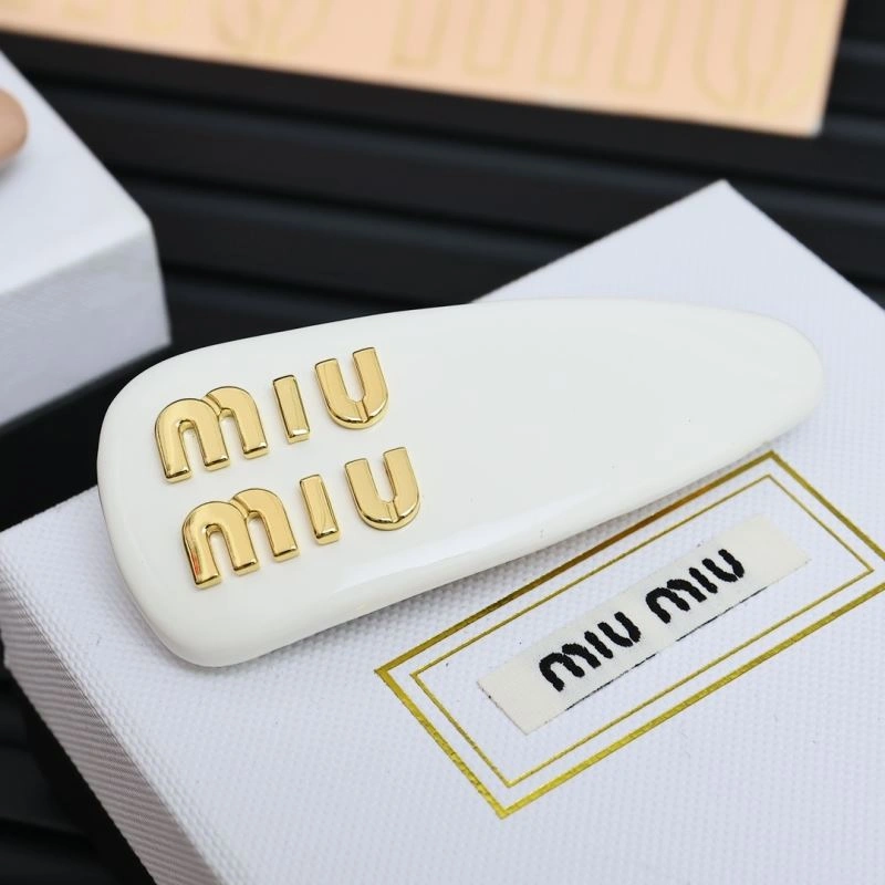 Indistinguishable Miu Miu Hairpins