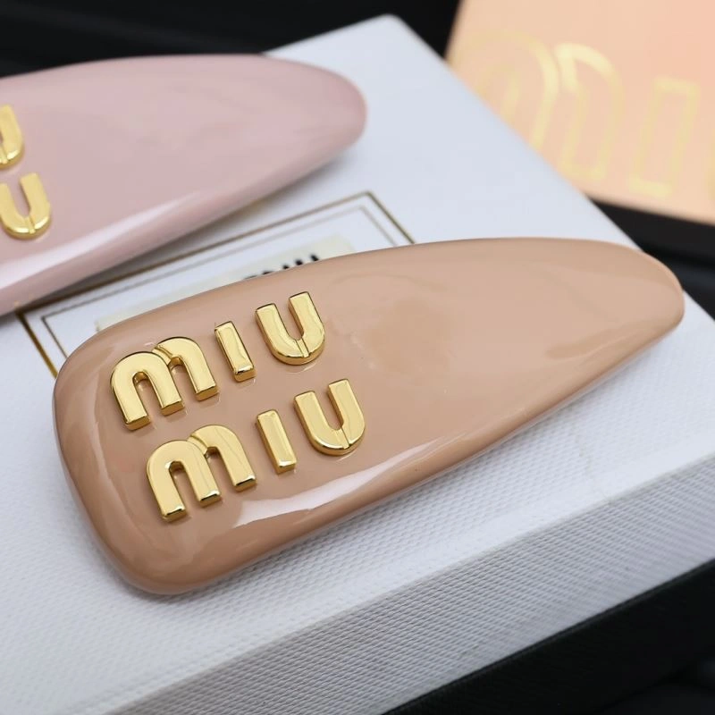 Indistinguishable Miu Miu Hairpins