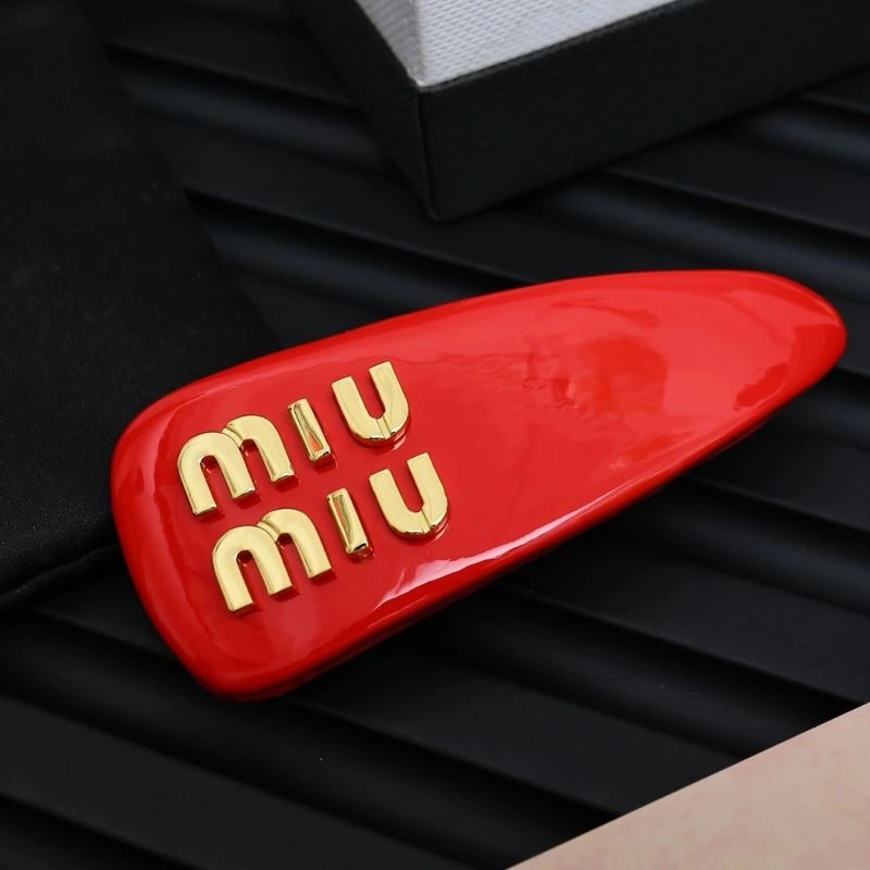 Indistinguishable Miu Miu Hairpins