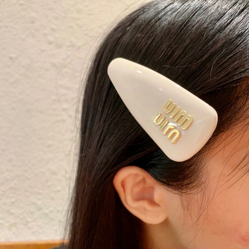 Indistinguishable Miu Miu Hairpins