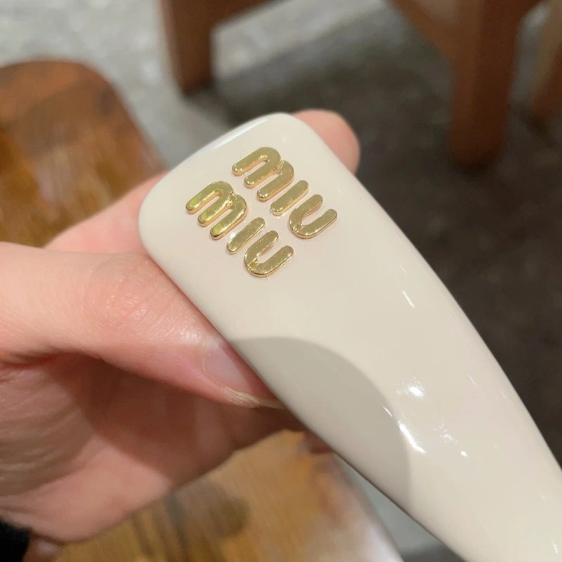 Indistinguishable Miu Miu Hairpins