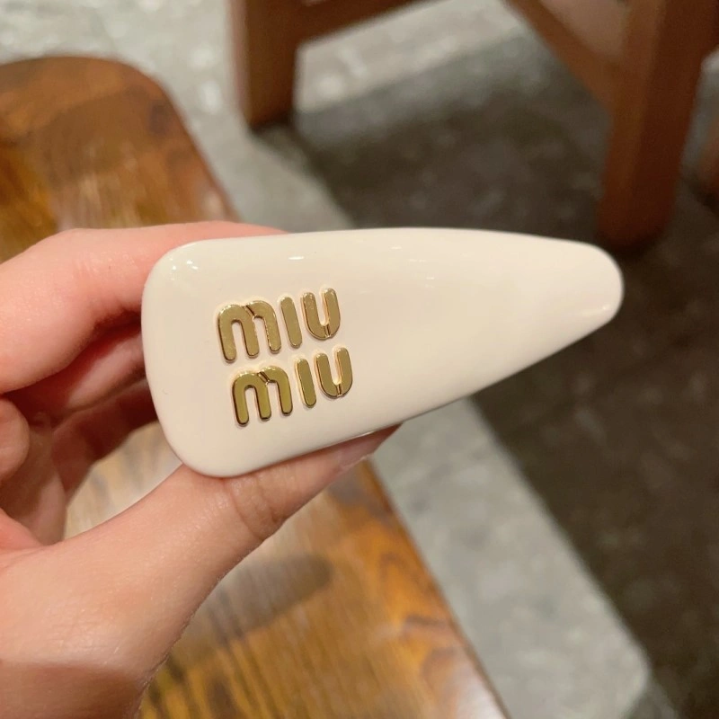 Indistinguishable Miu Miu Hairpins