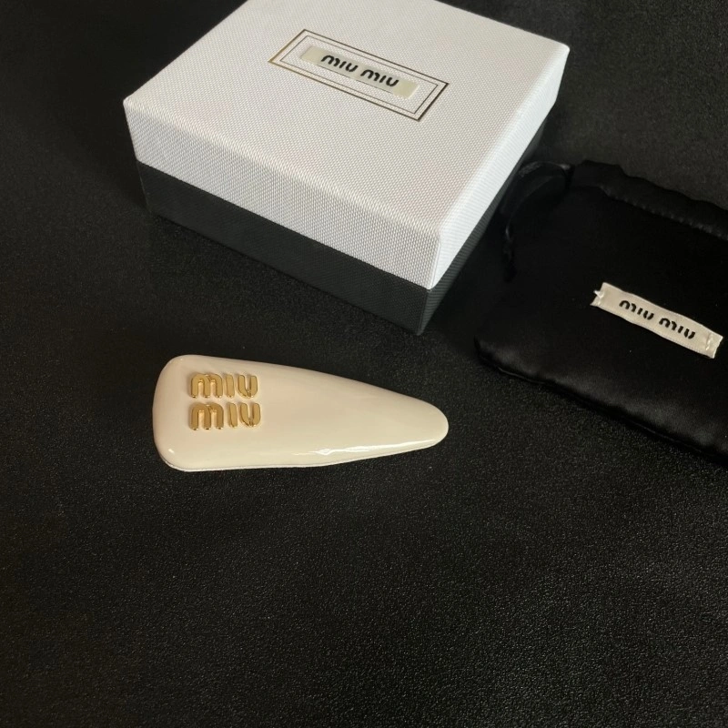 Indistinguishable Miu Miu Hairpins
