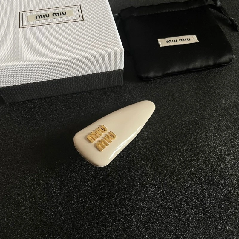 Indistinguishable Miu Miu Hairpins