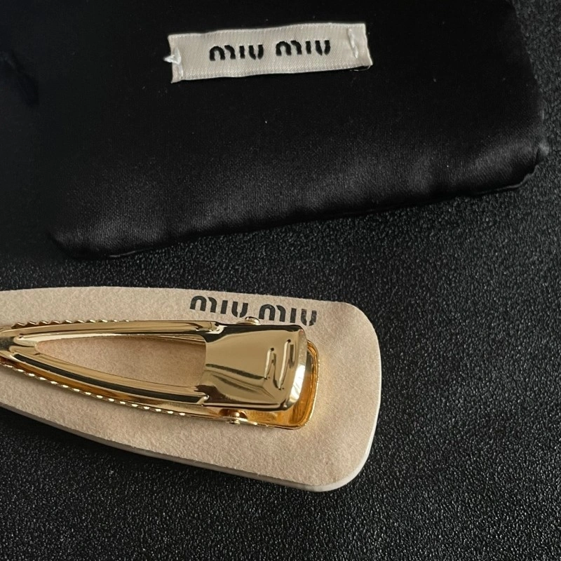 Indistinguishable Miu Miu Hairpins