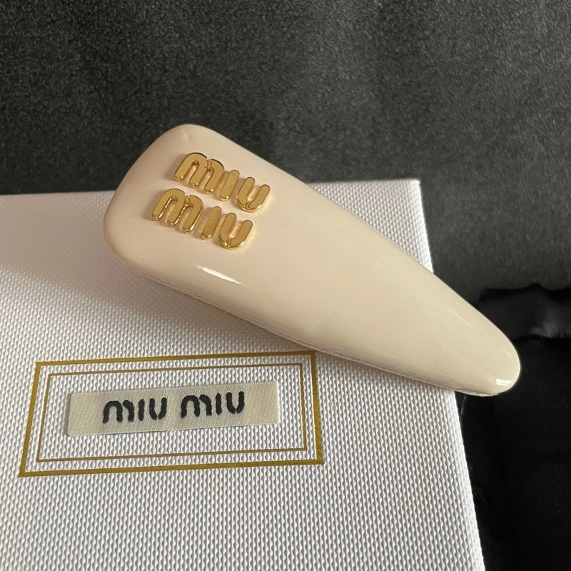 Indistinguishable Miu Miu Hairpins