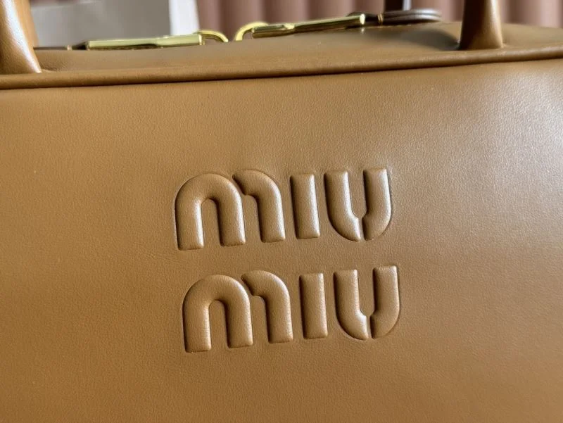 Indistinguishable Miu Miu Top Handle Bags