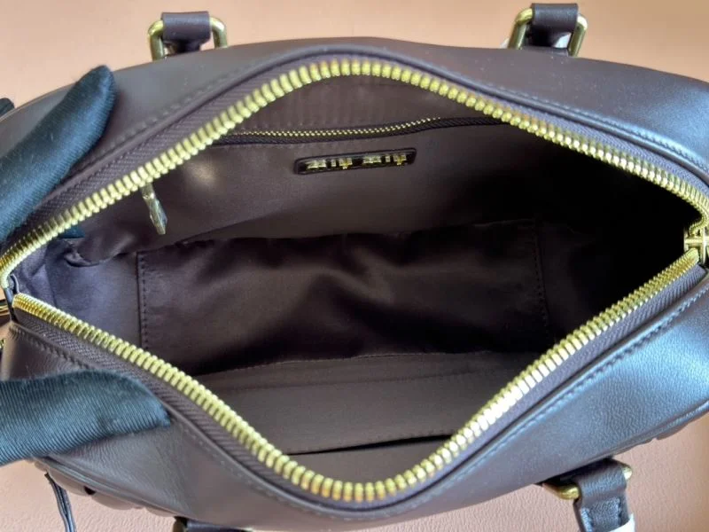 Value-priced Miu Miu Top Handle Bags