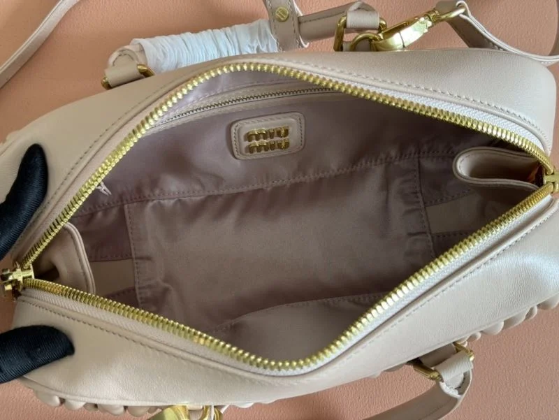 Indistinguishable Miu Miu Top Handle Bags
