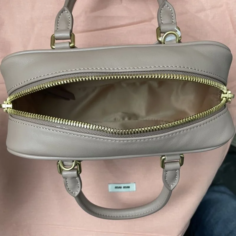 Value-priced Miu Miu Top Handle Bags