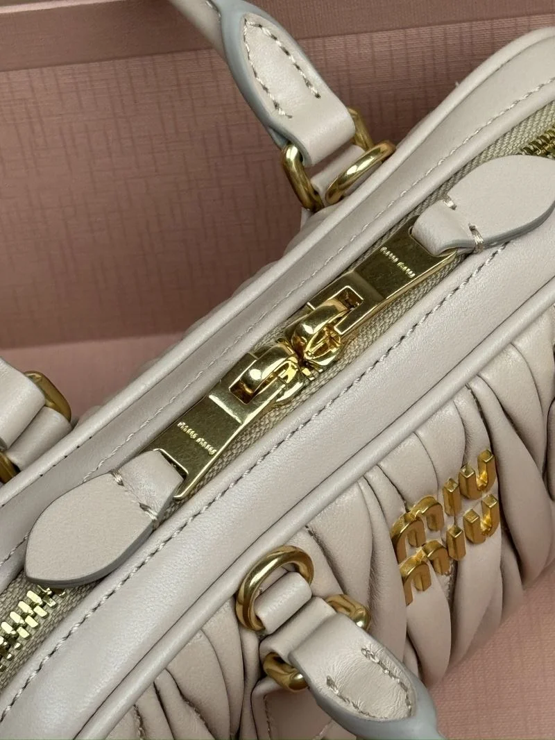 Value-priced Miu Miu Top Handle Bags