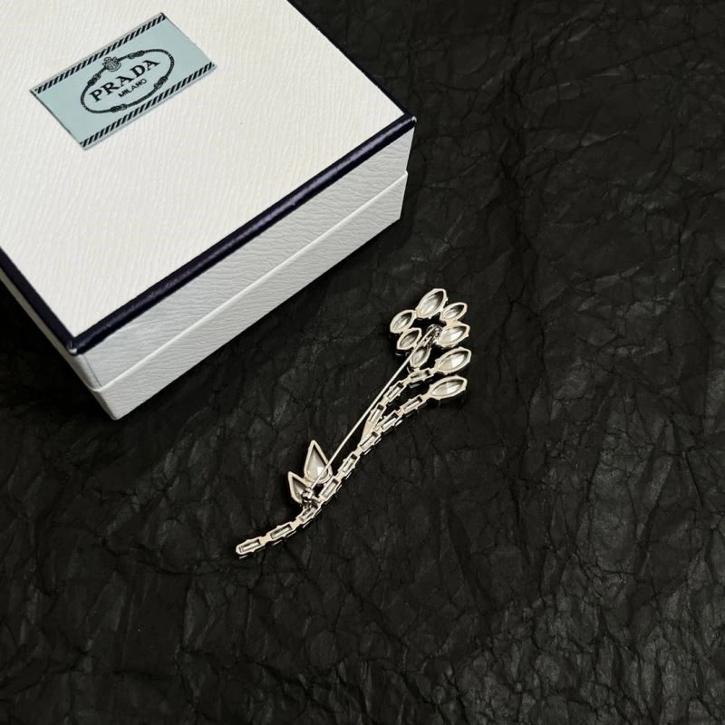 Low-cost Prada Brooches