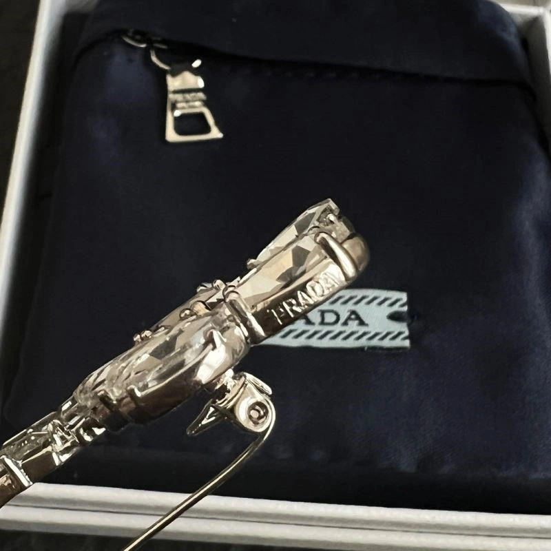 Low-cost Prada Brooches