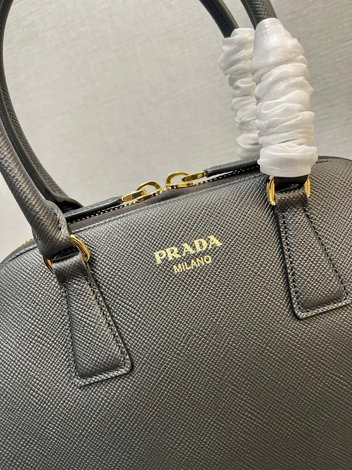 Indistinguishable Prada Top Handle Bags