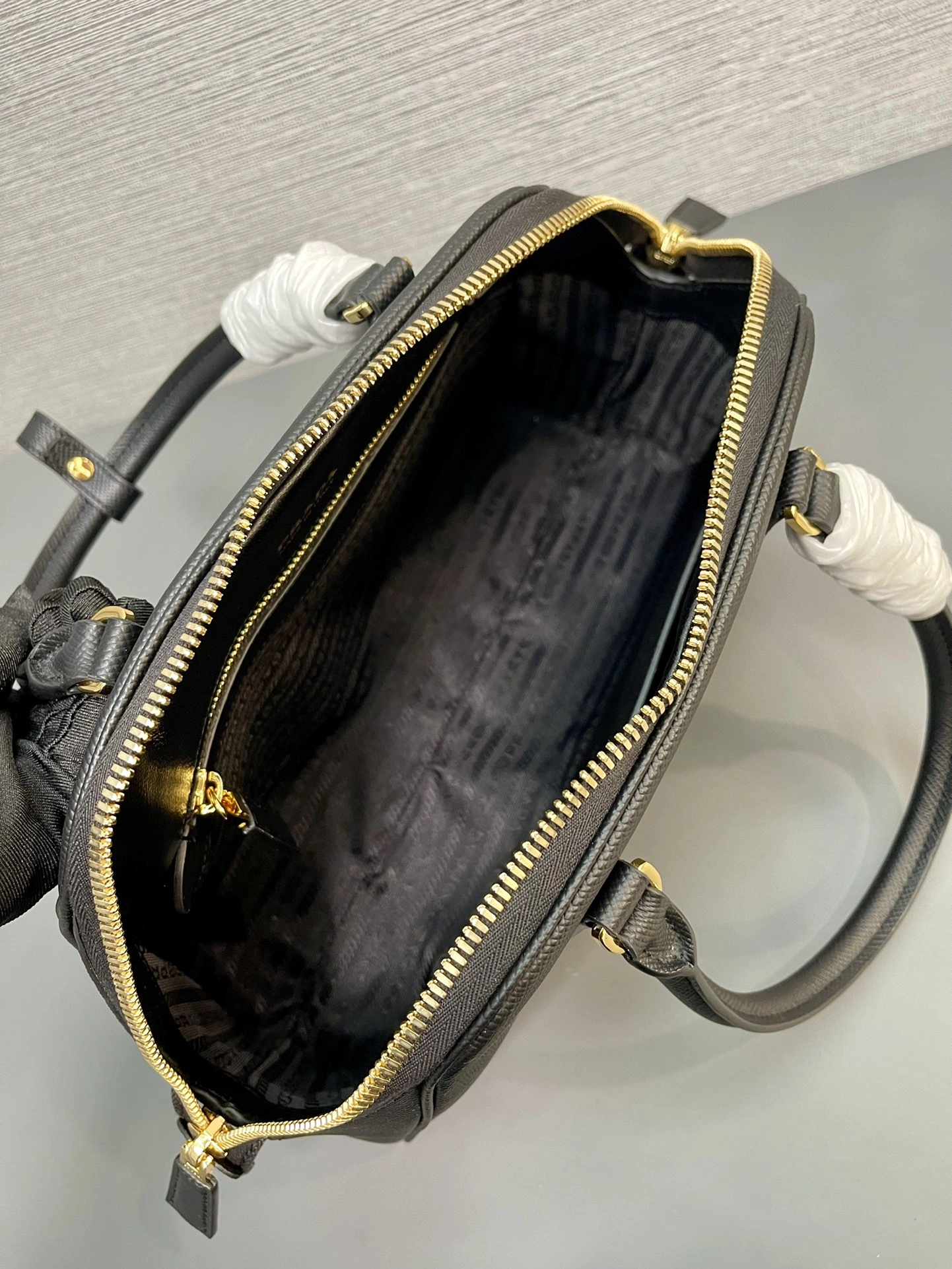 Indistinguishable Prada Top Handle Bags