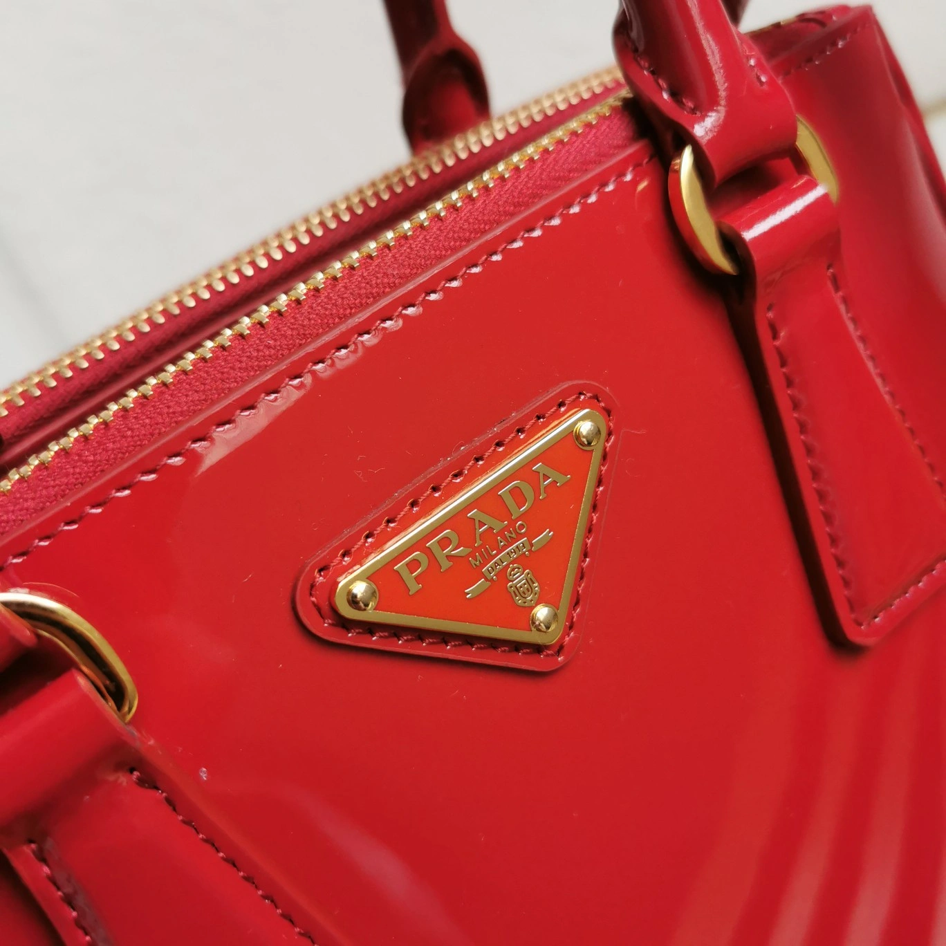Brand-authenticated Prada Top Handle Bags