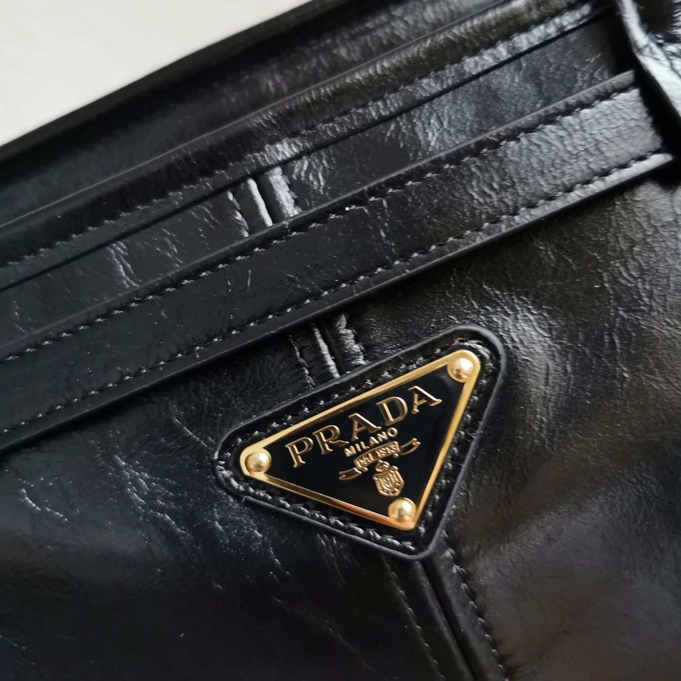 Brand-authenticated Prada Top Handle Bags
