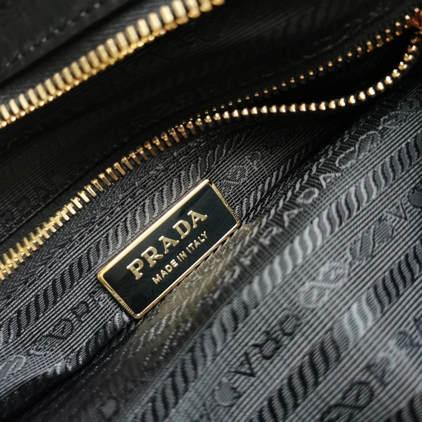 Brand-authenticated Prada Top Handle Bags
