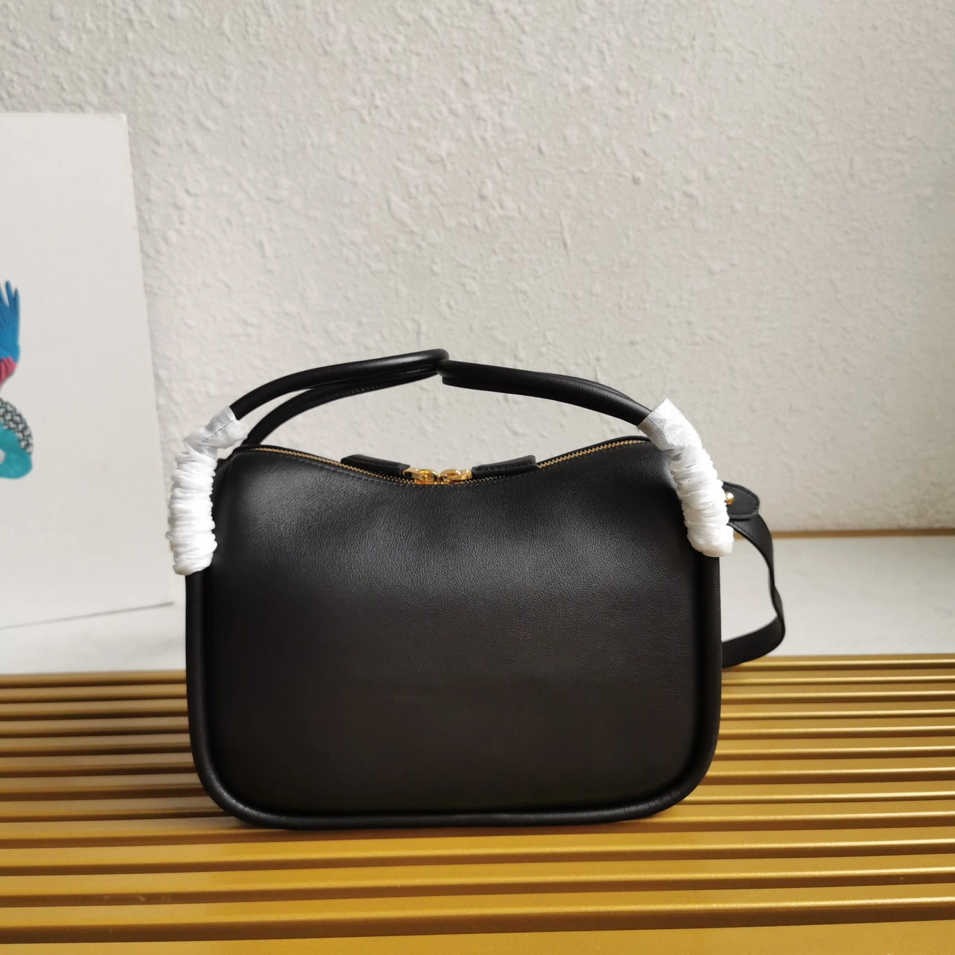 Value-priced Prada Top Handle Bags