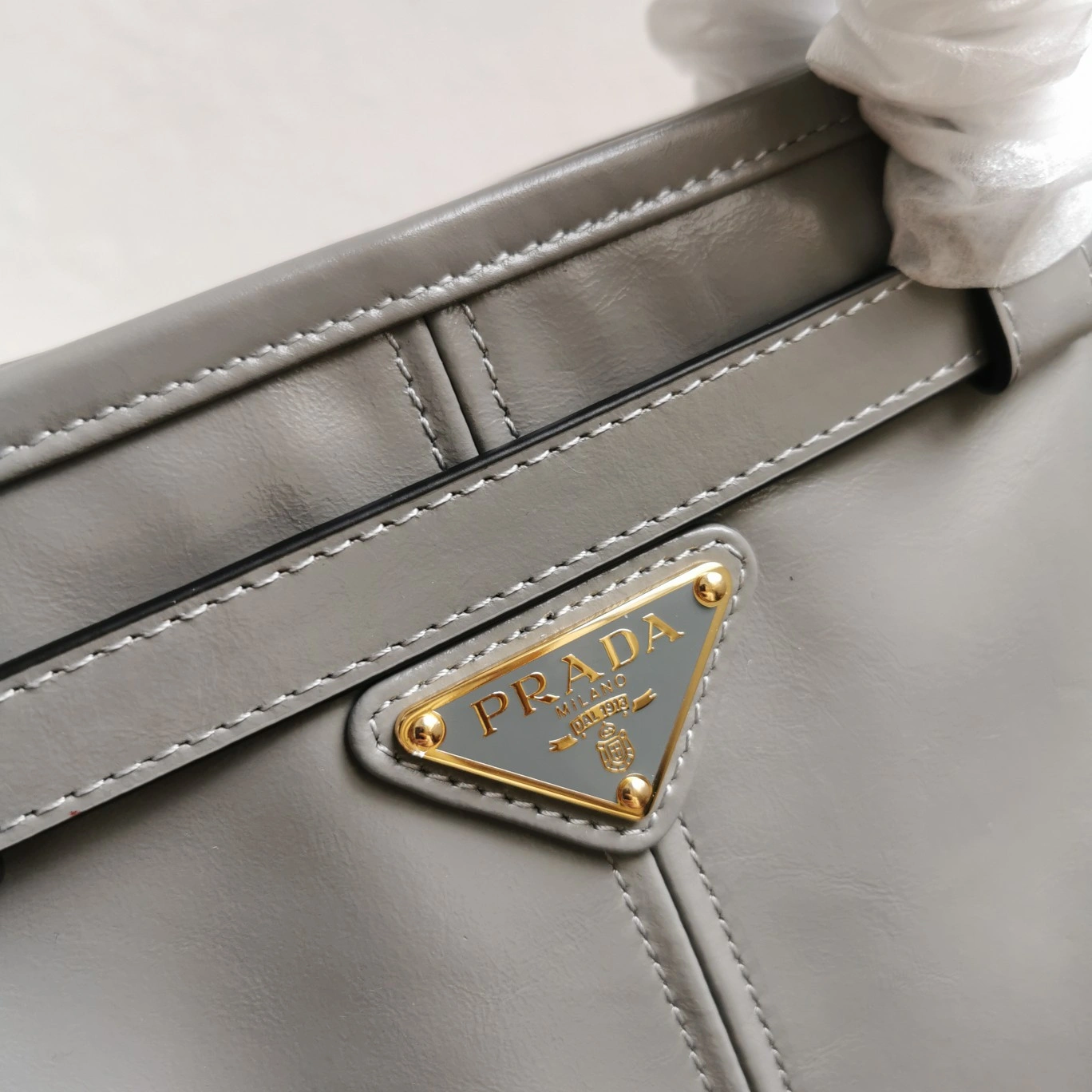 Brand-authenticated Prada Top Handle Bags