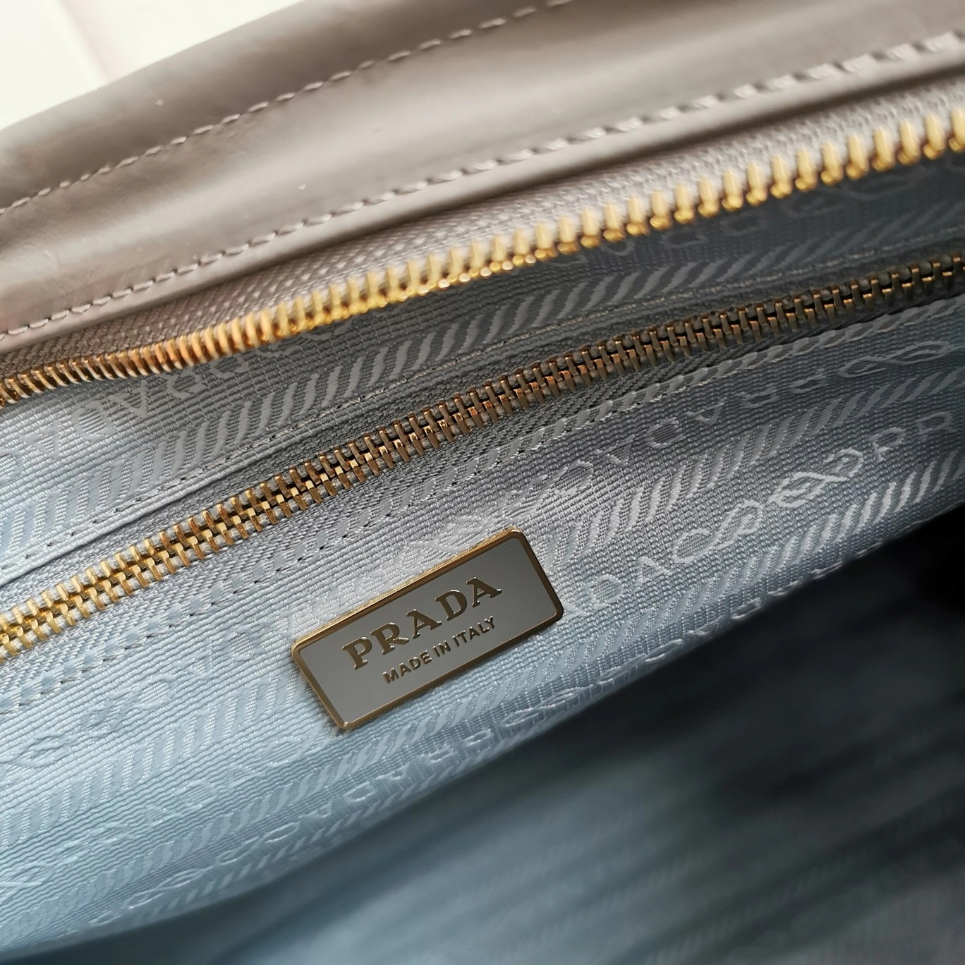 Brand-authenticated Prada Top Handle Bags