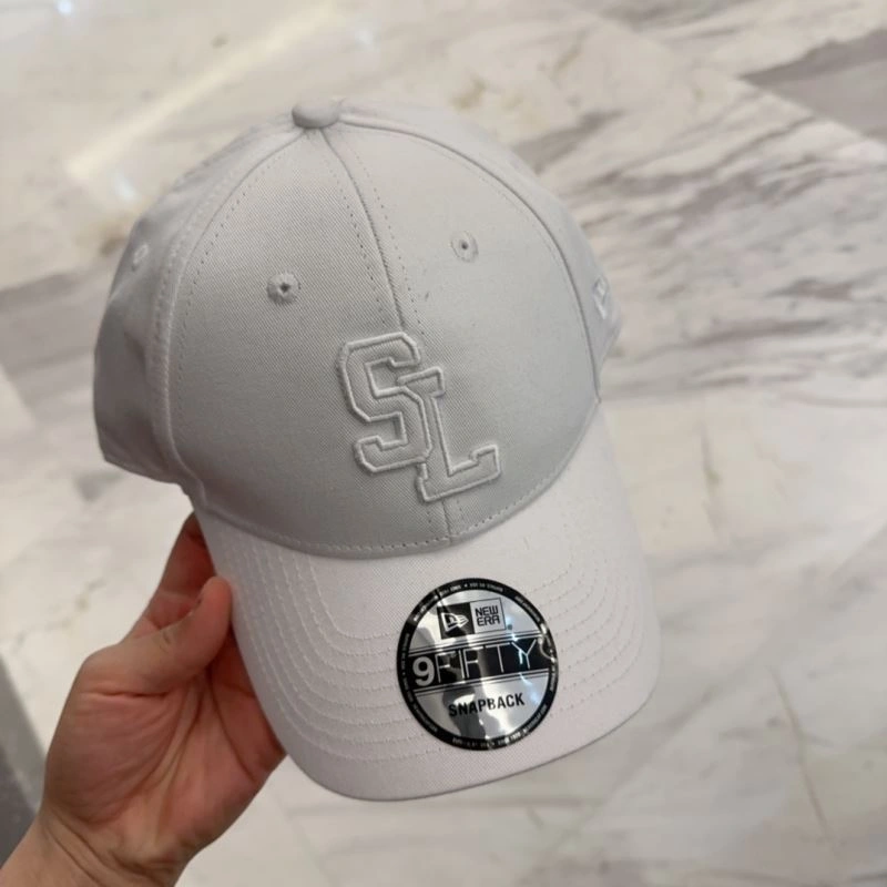 Value-priced YSL Caps