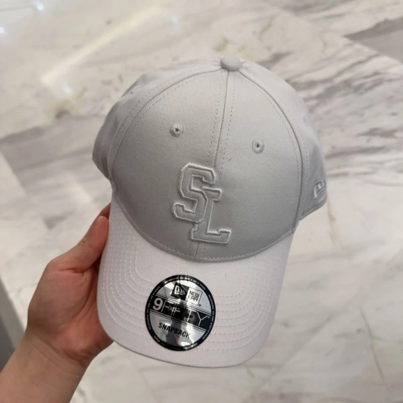Value-priced YSL Caps